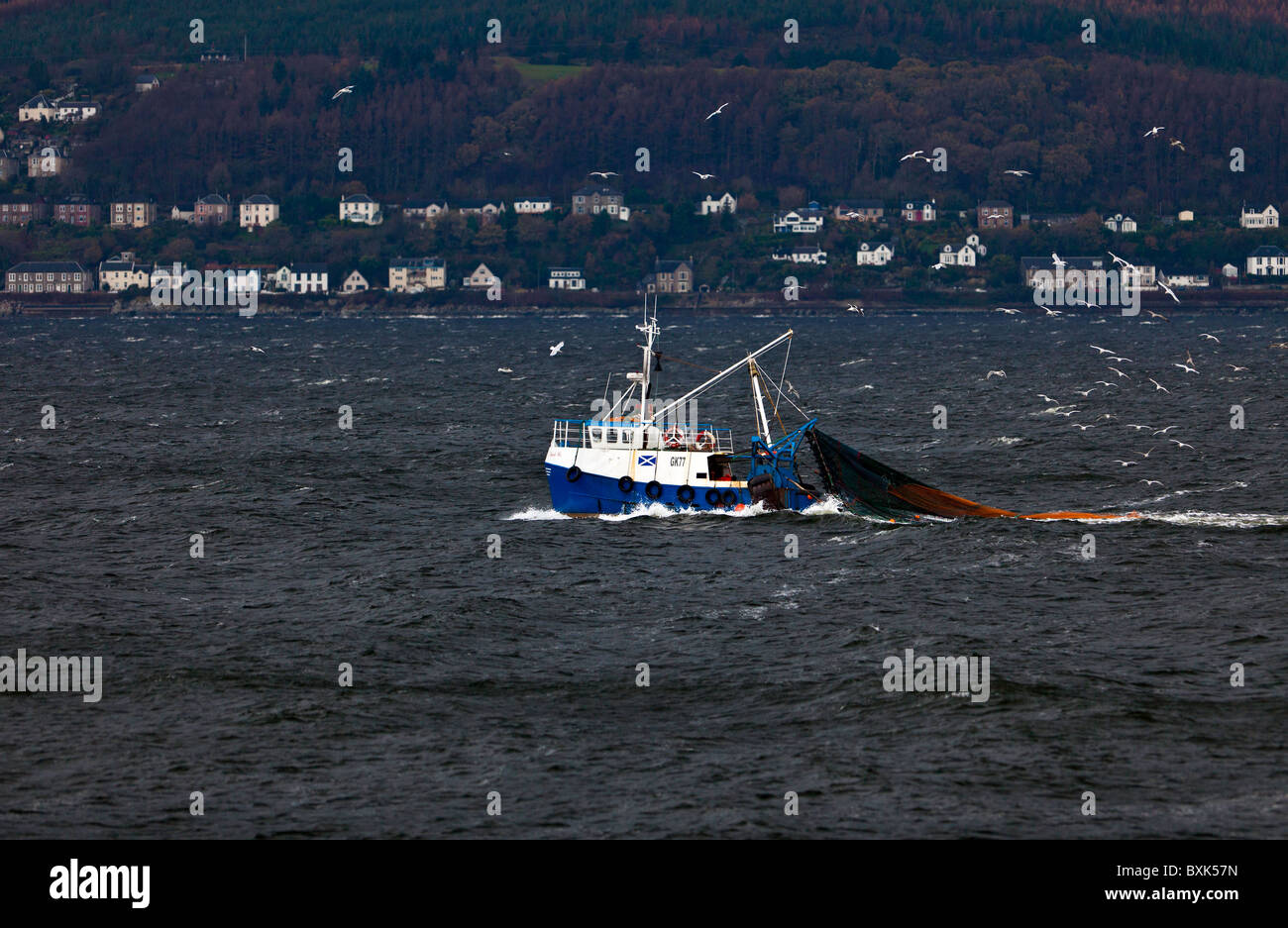 Clyde fishing boat hauling in her nets Stock Photo - Alamy