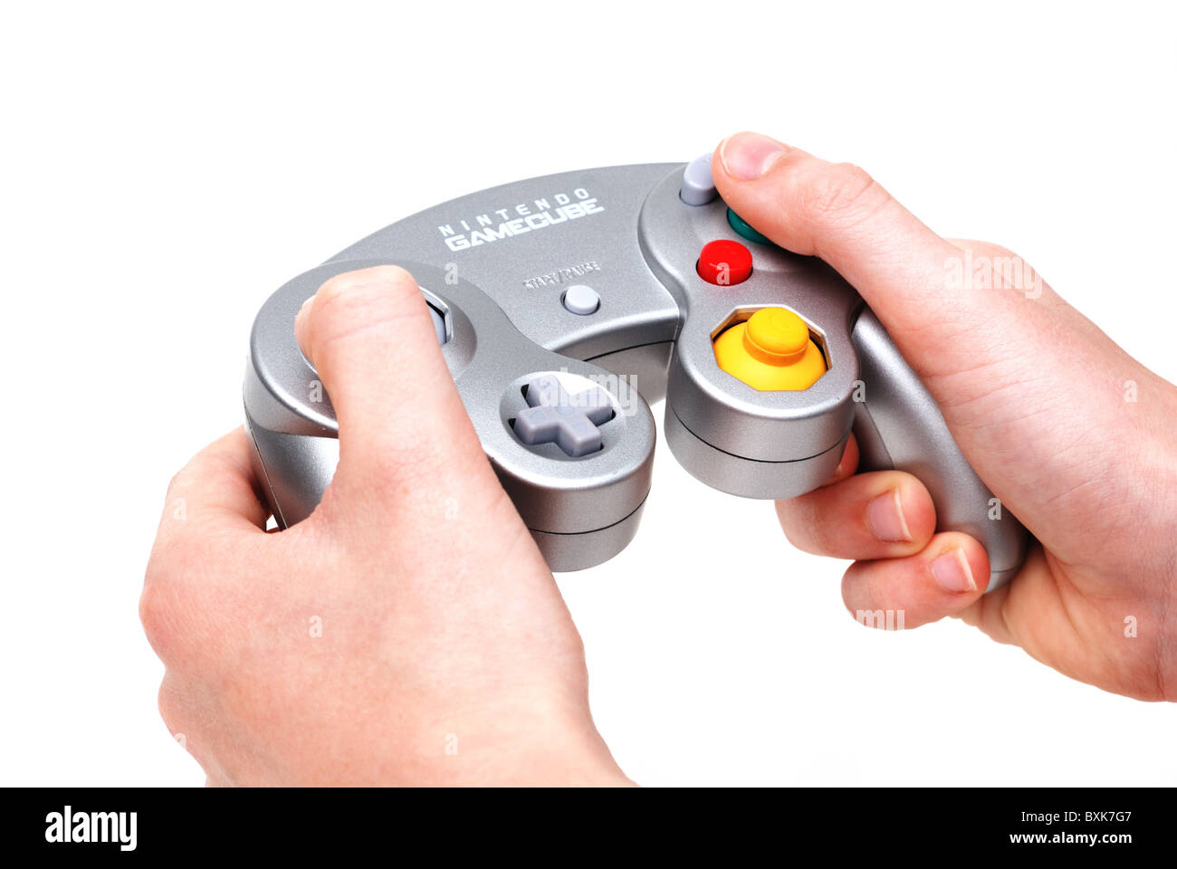 Teen hands playing with Nintendo game cube handset controller Stock ...