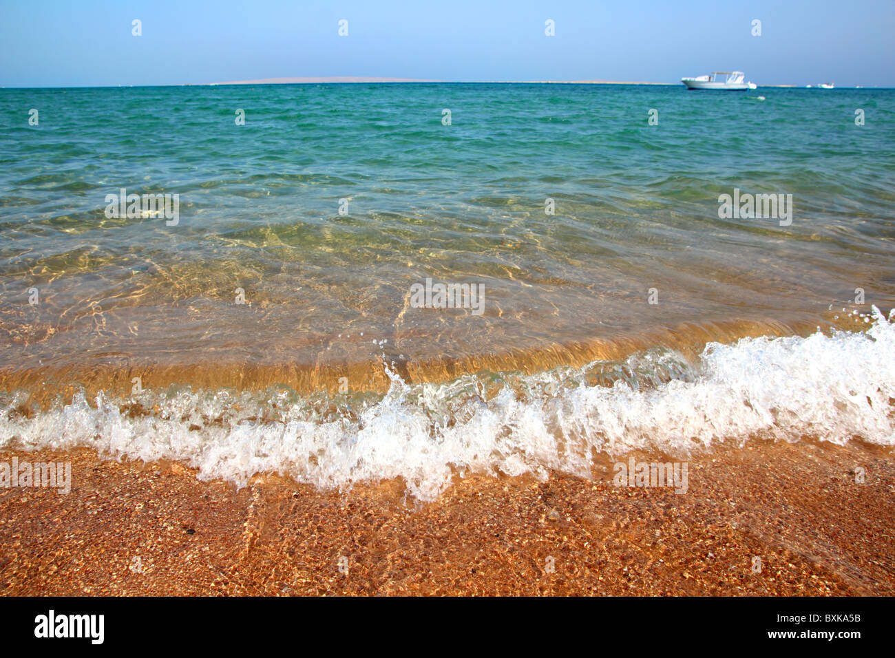 sea waves and gold sand beach - resort background Stock Photo - Alamy