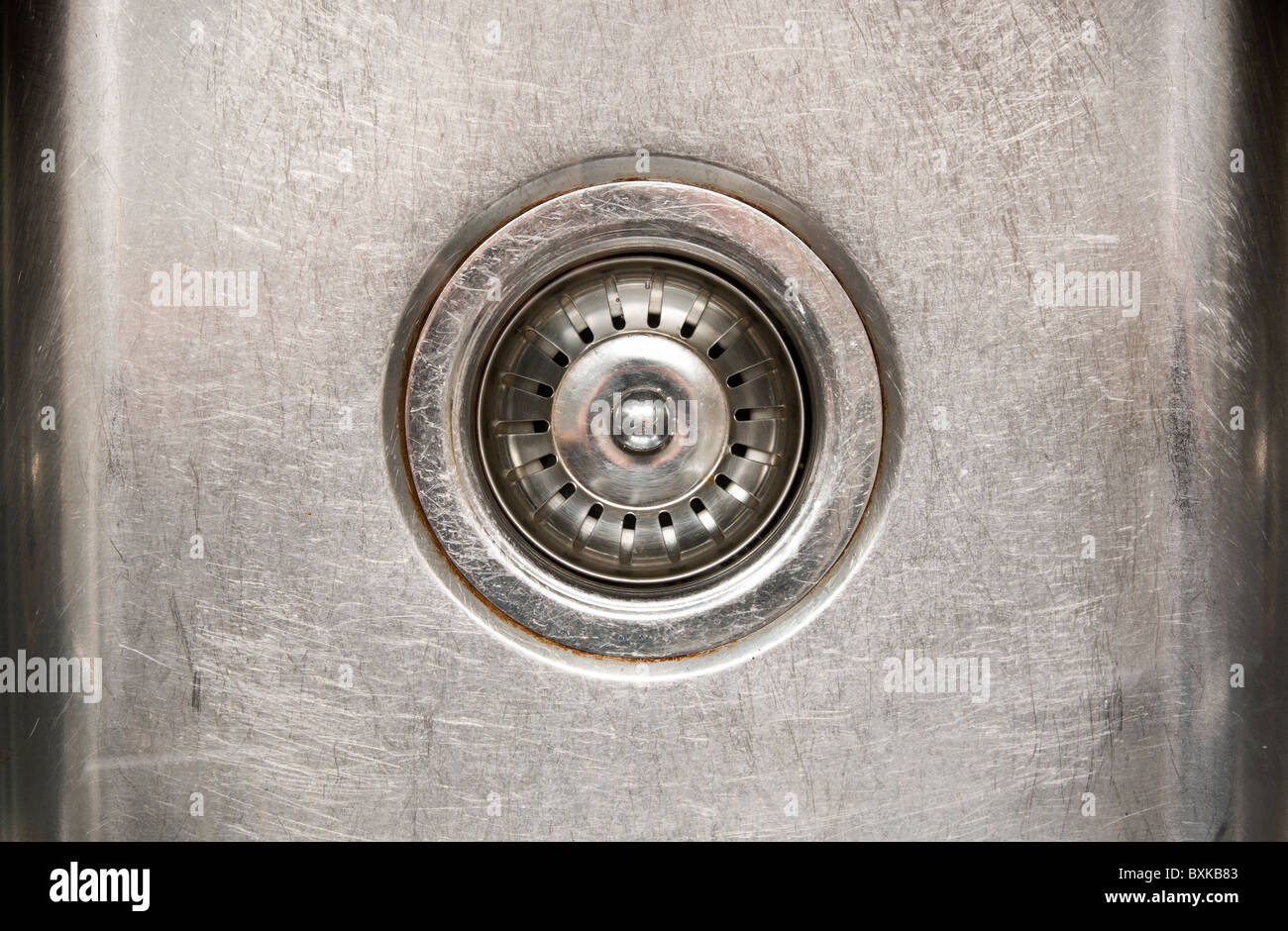 Stainless steel sink plug in a sink with water Stock Photo - Alamy