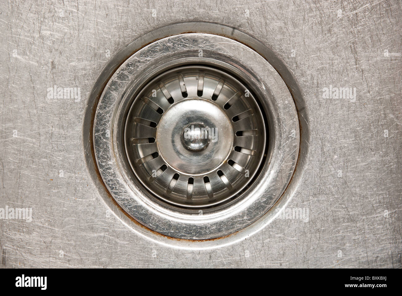Stainless steel sink plug in a sink with water Stock Photo - Alamy