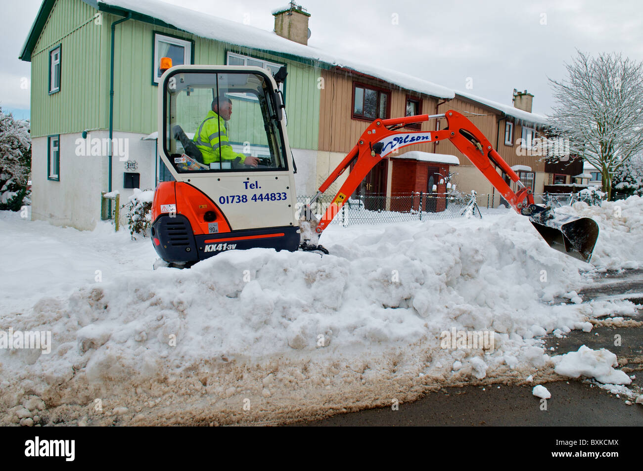 Road workers clear the roads of thick snow Stock Photo - Alamy