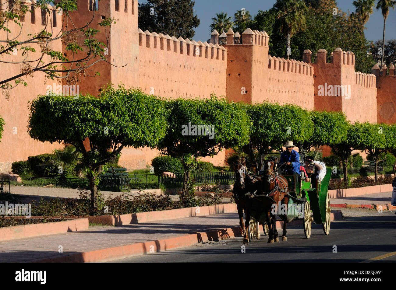 Caleche passing city walls along Boulevard Yarmouk one of the best ways ...
