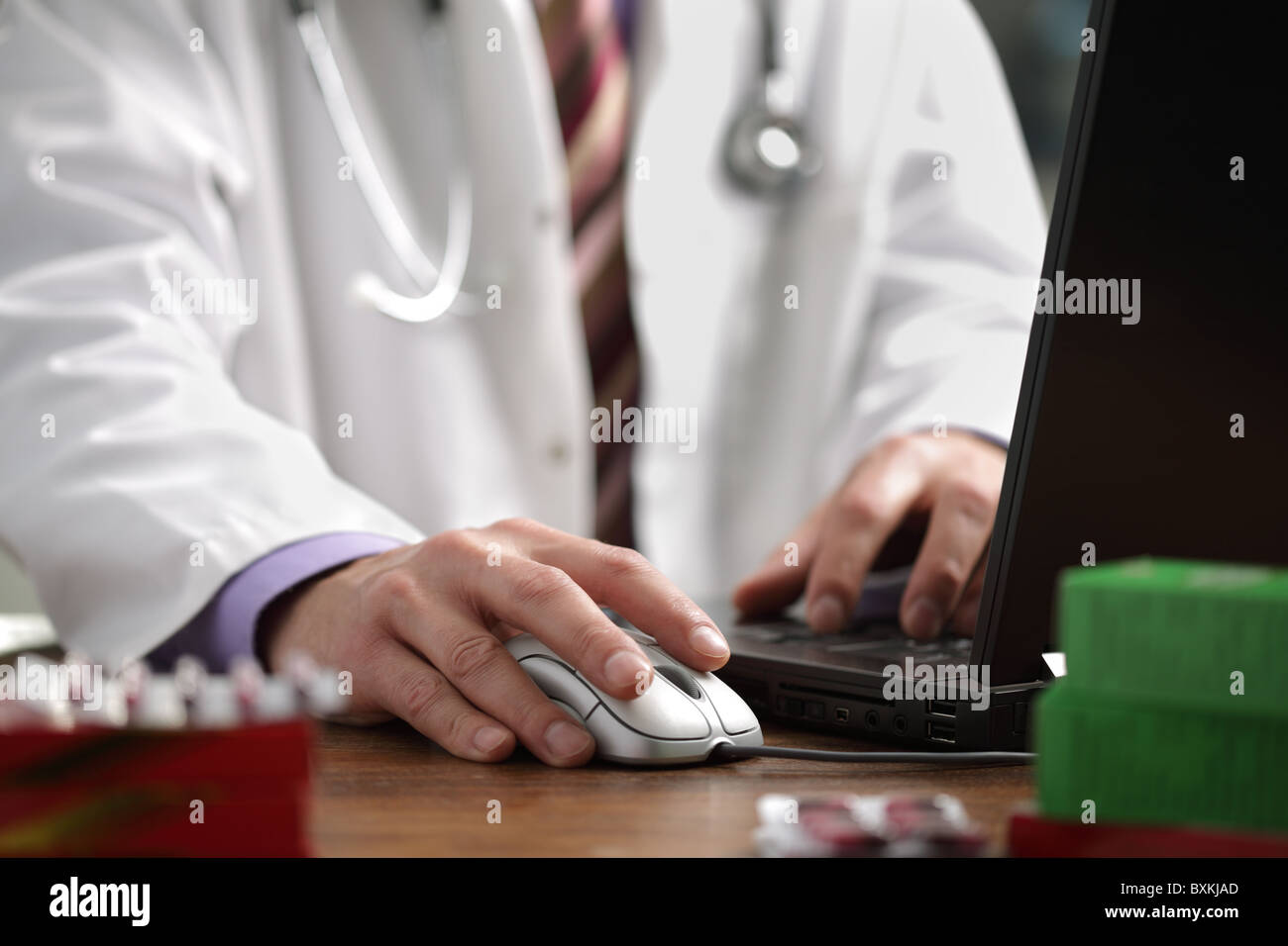 Doctor using computer Stock Photo - Alamy
