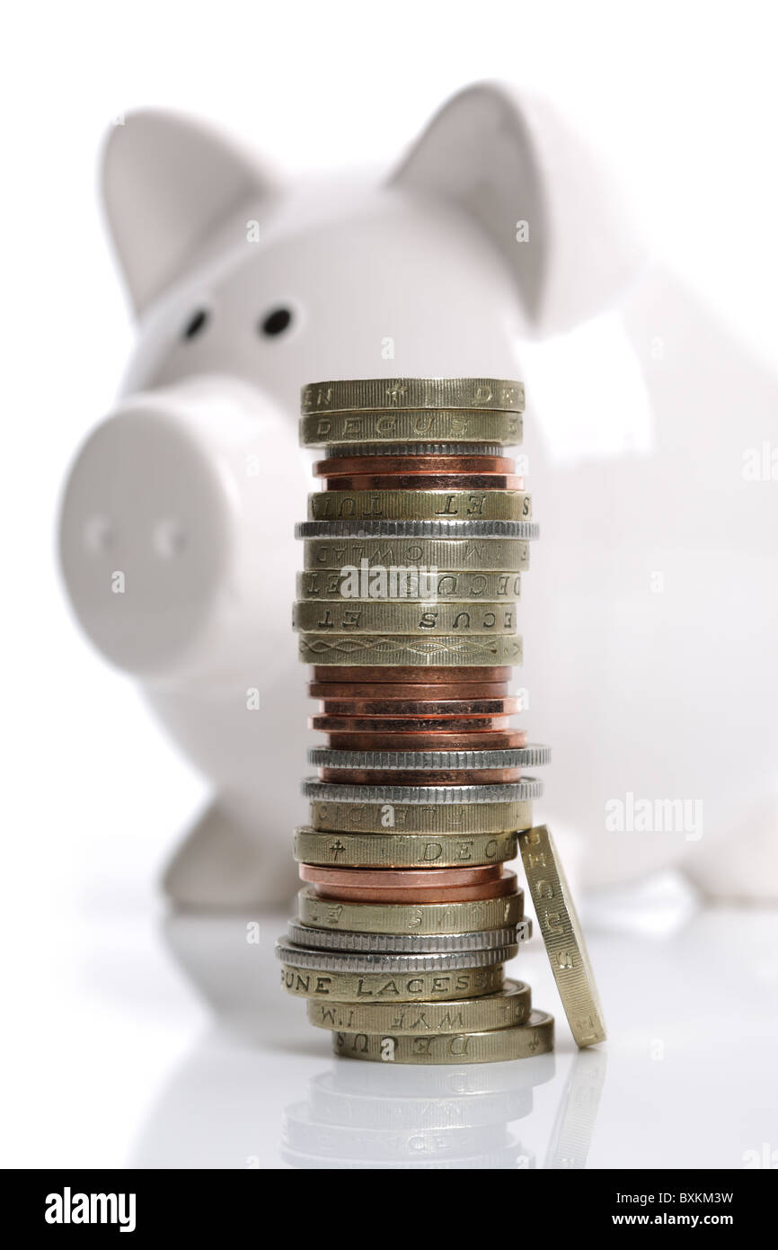 Piggy bank and coins Stock Photo - Alamy