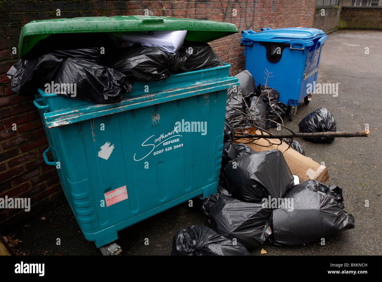 Overflowing refuse bin London UK Stock Photo - Alamy