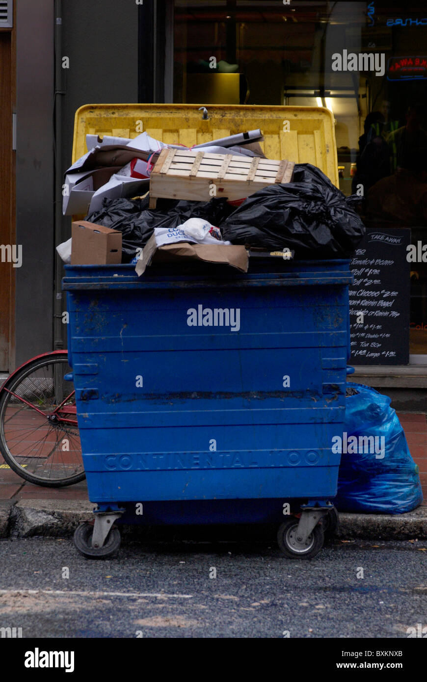 Overflowing refuse bin London UK Stock Photo - Alamy