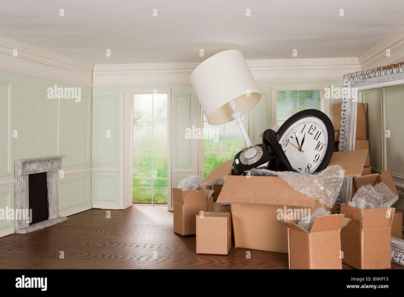 Cardboard boxes of objects in tiny room Stock Photo - Alamy