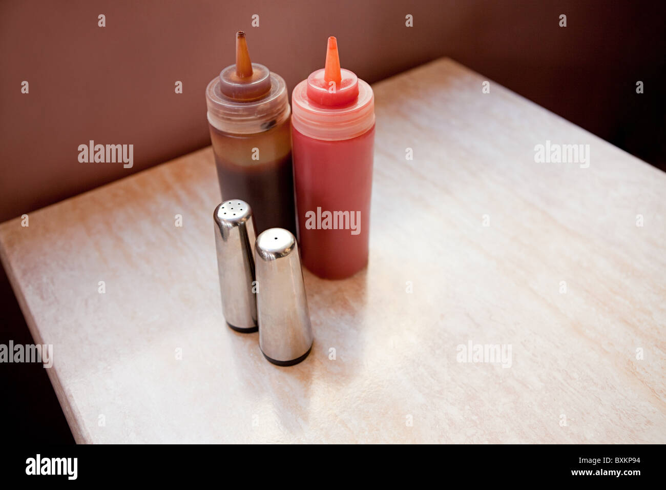 Condiments on cafe table Stock Photo - Alamy