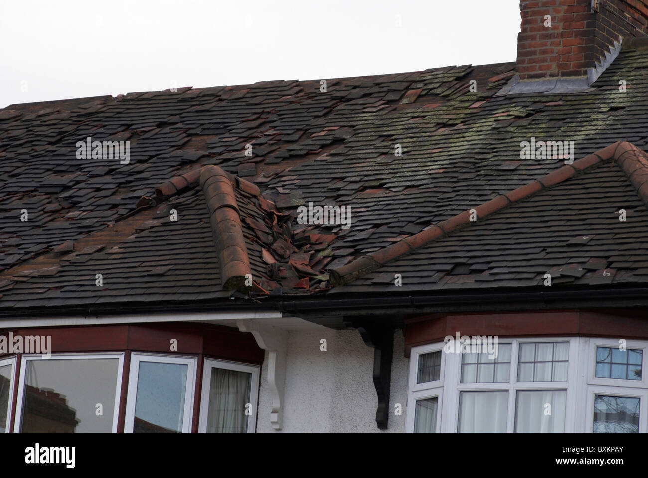 Tile roof damage hi-res stock photography and images - Alamy