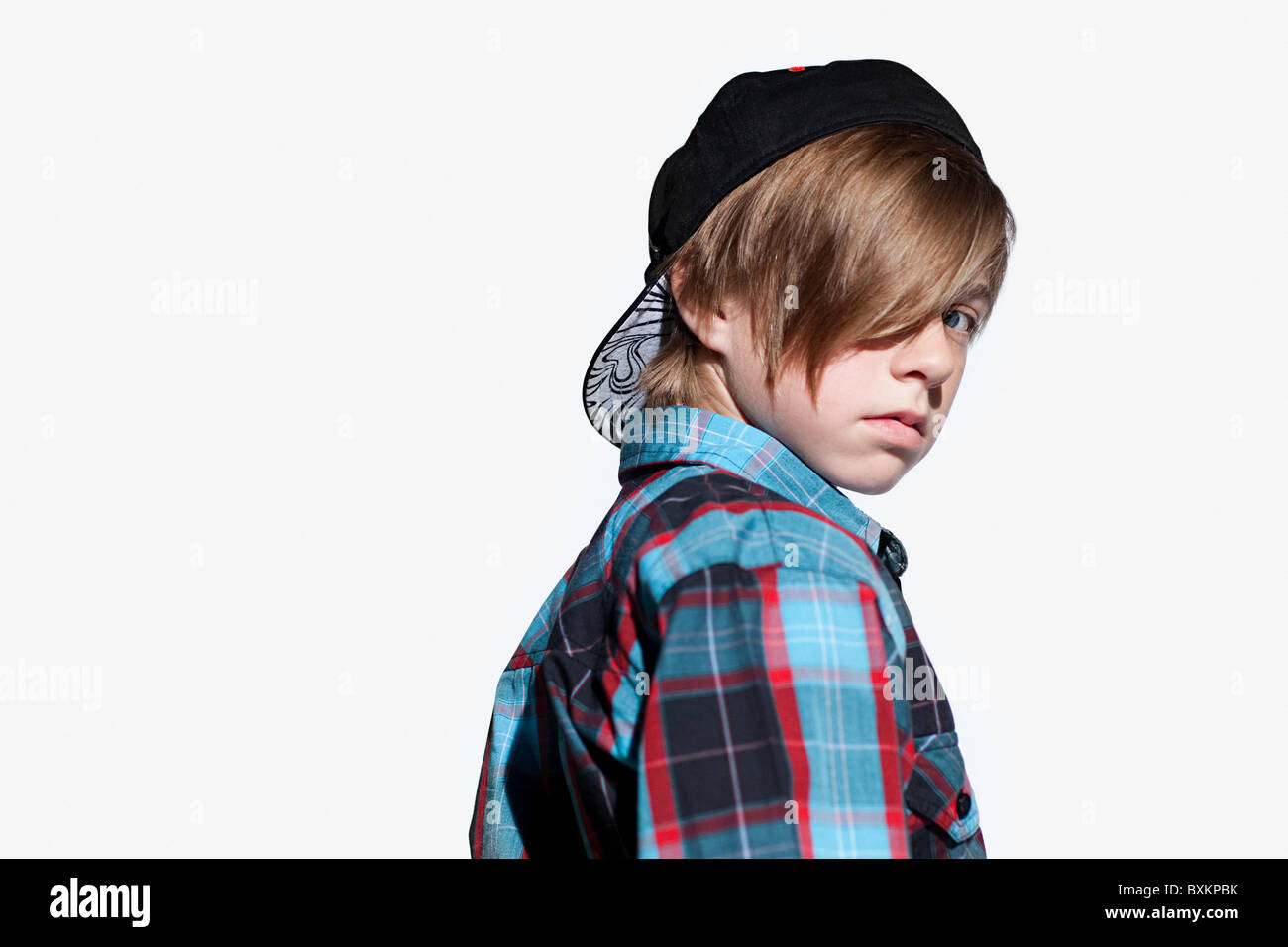 Teenage boy looking over shoulder Stock Photo - Alamy