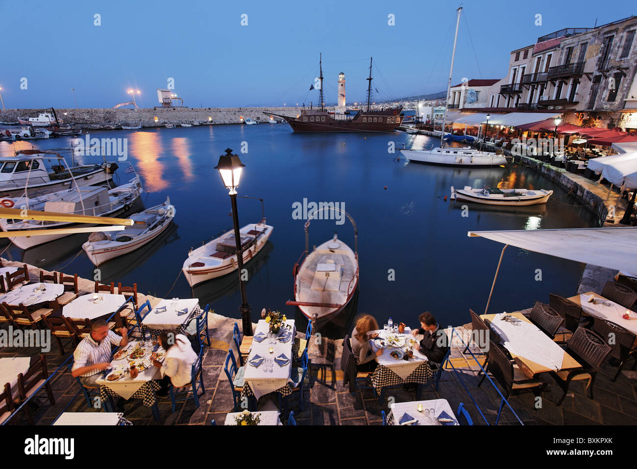 Restaurant, old venetian port in the evening, Rethymnon, Crete, Greece ...
