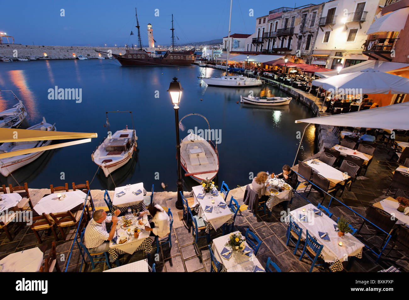 Restaurant, old venetian port in the evening, Rethymnon, Crete, Greece ...
