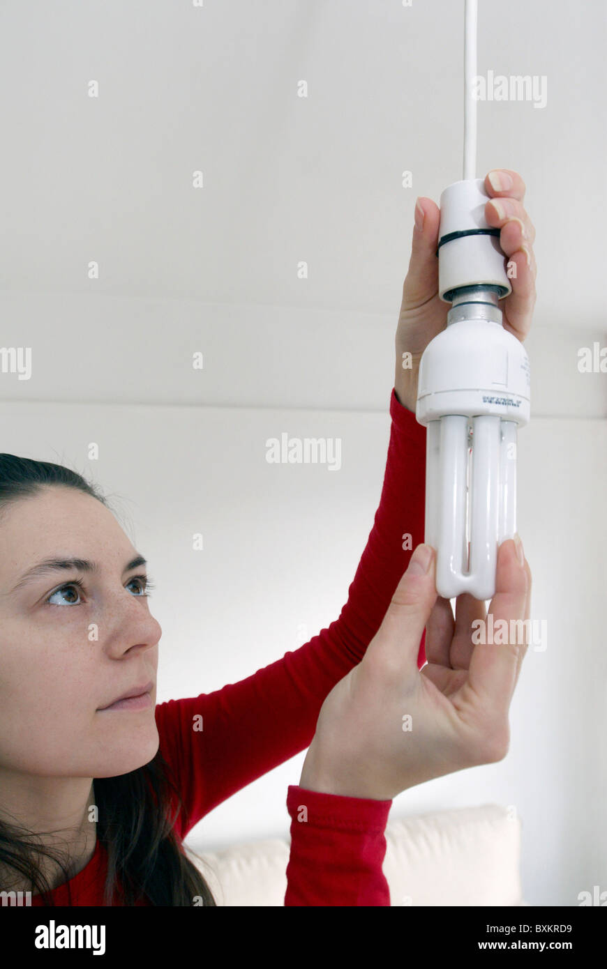 Fixing Light Fitting Woman High Resolution Stock Photography and Images ...