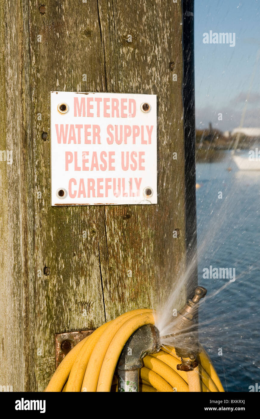 Burst water pipe Stock Photo - Alamy