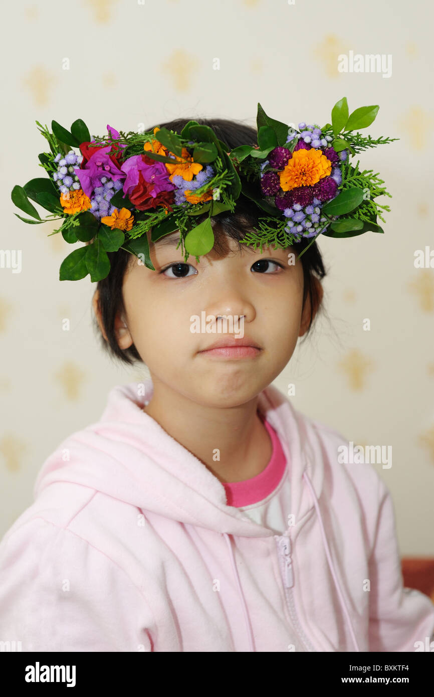 Asian kid with wreath on head Stock Photo - Alamy