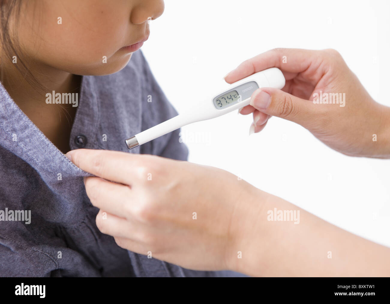 A boy checking his temperature Stock Photo - Alamy