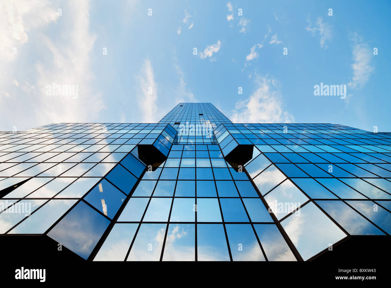 Blue sky reflected on modern skyscraper windows Stock Photo - Alamy