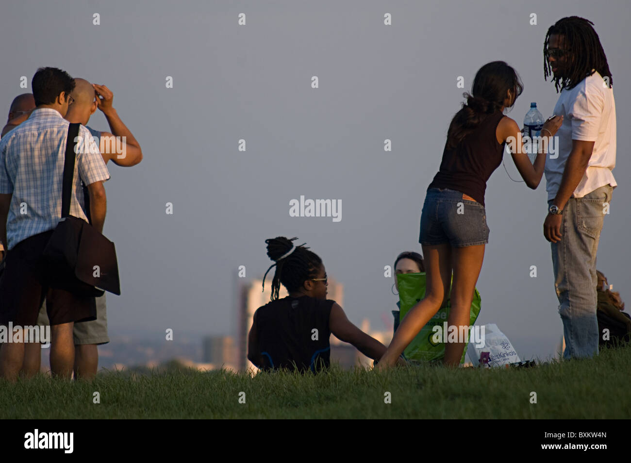 Friends socializing at primrose hill London Stock Photo - Alamy