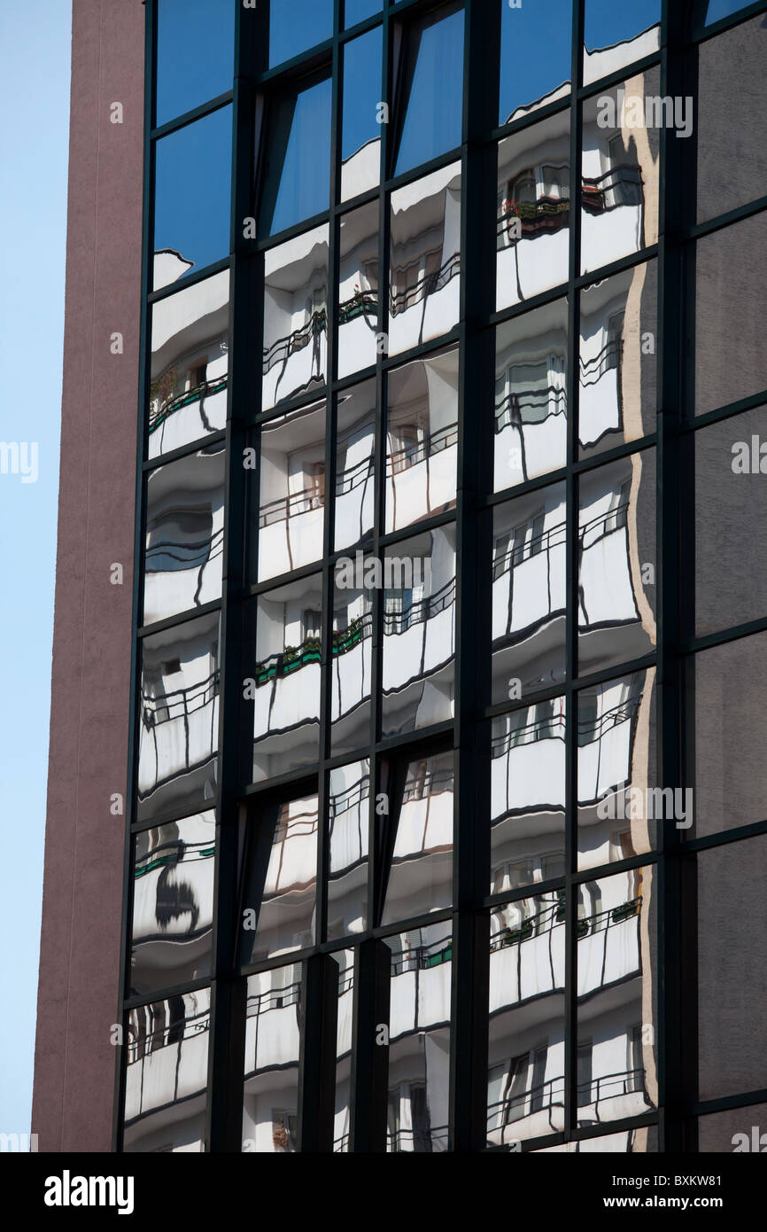 Apartment building reflection in a corporate office building windows ...