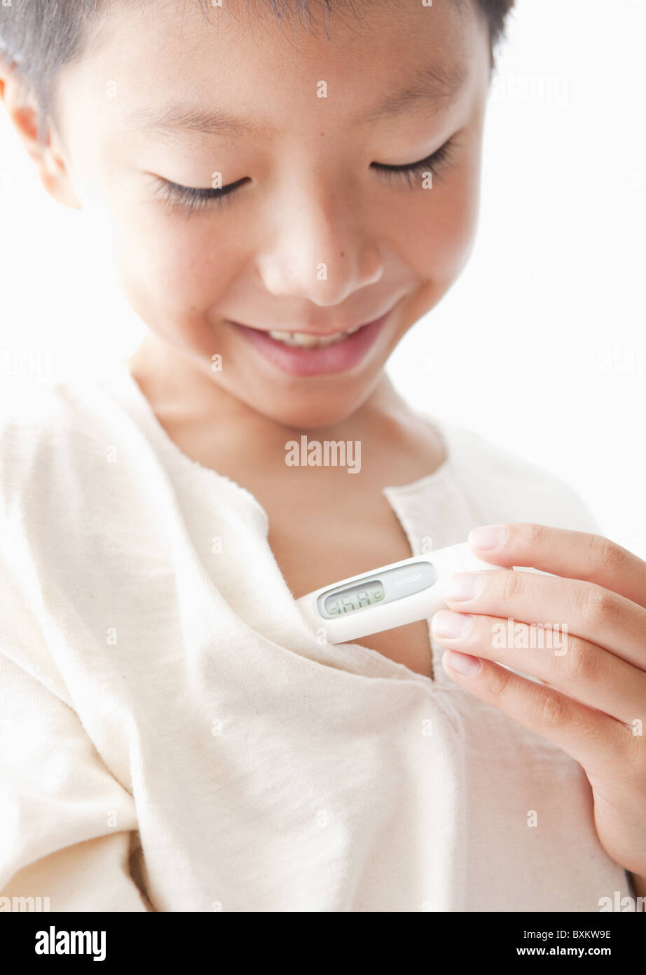 A boy checking his temperature Stock Photo - Alamy