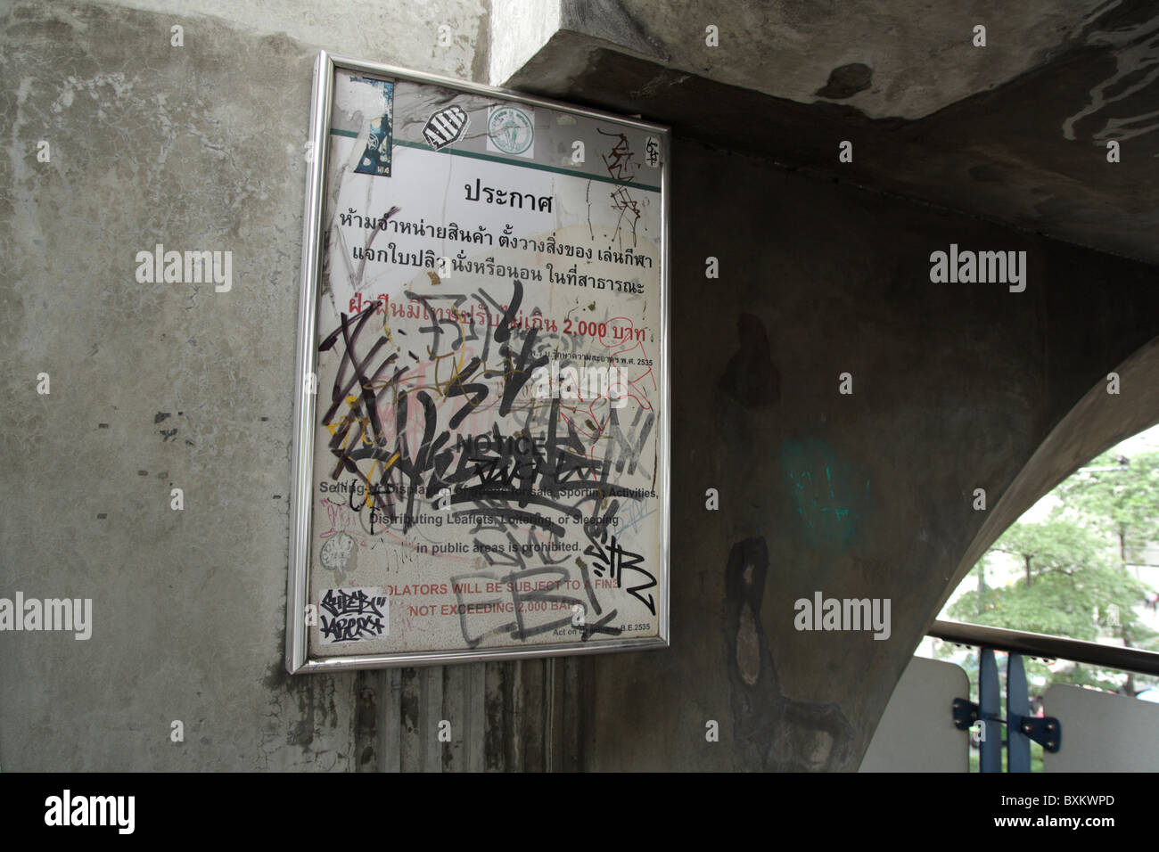 Painting on street sign in Bangkok Stock Photo - Alamy