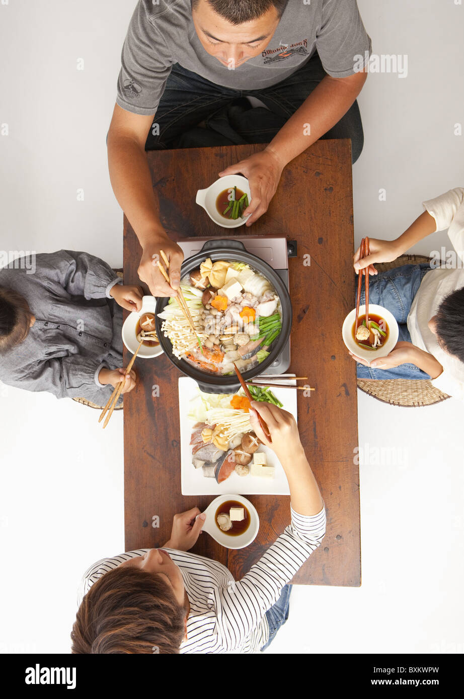 Mother serving supper to her children hi-res stock photography and ...