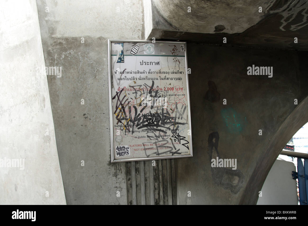 Painting on street sign in Bangkok Stock Photo - Alamy