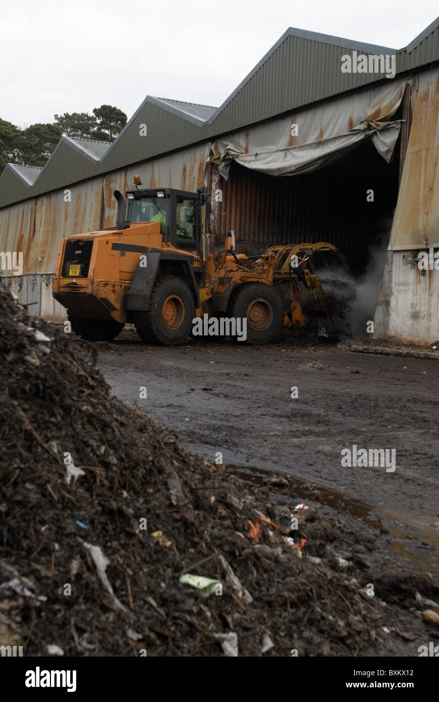 Front loader working at composting centre Stock Photo - Alamy