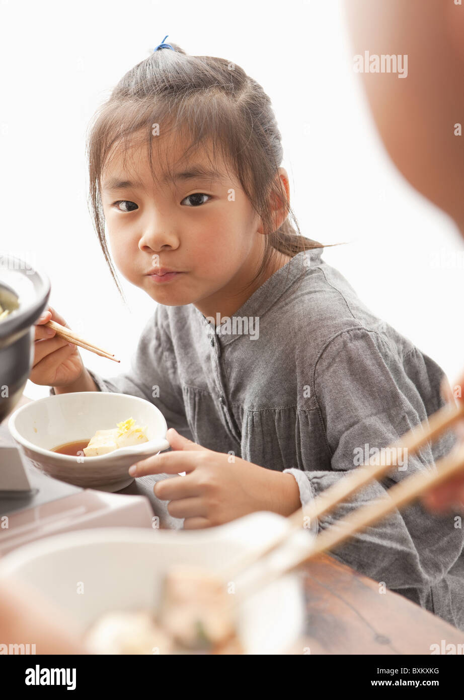 A girl eating Japanese nabe Stock Photo - Alamy