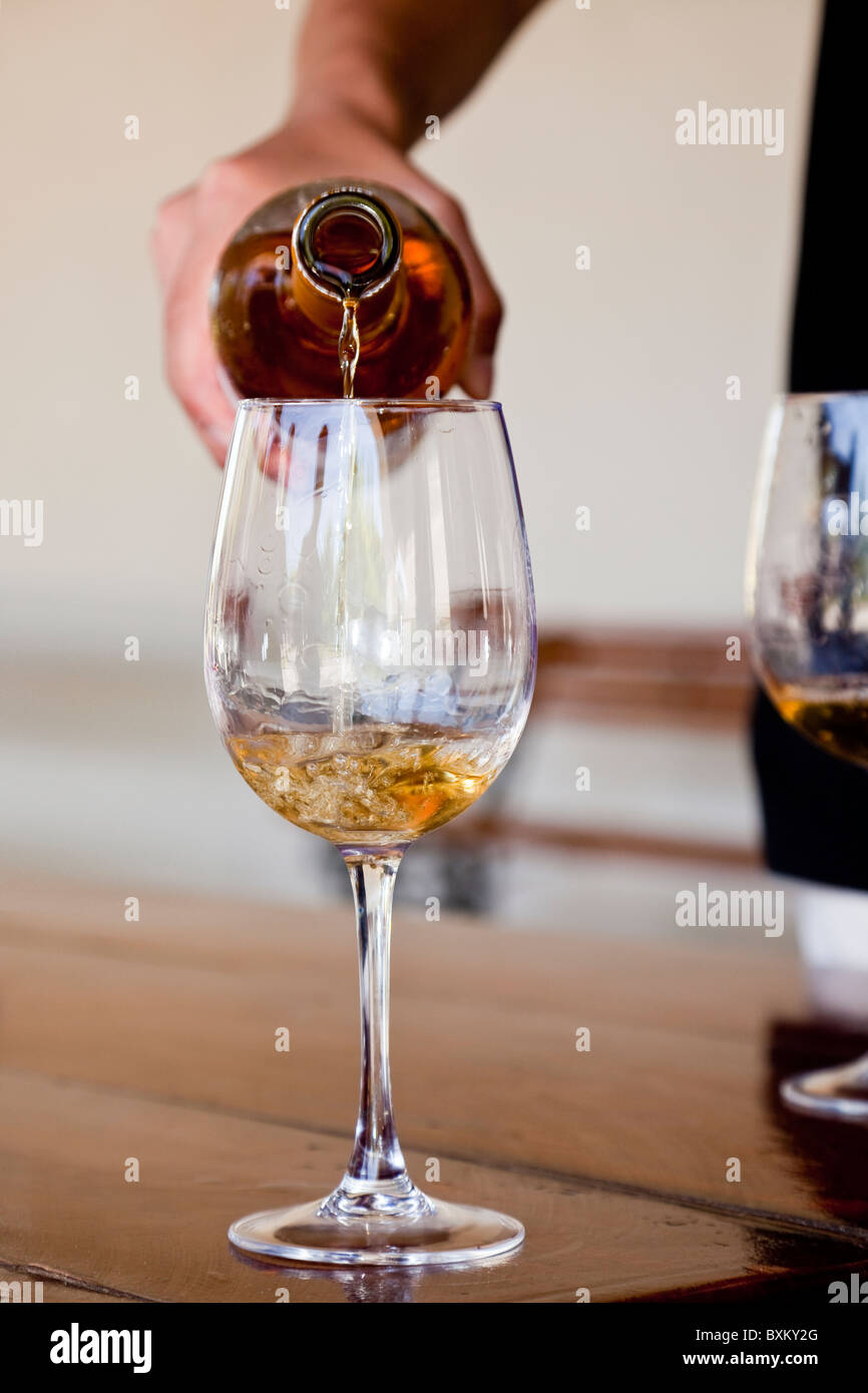 Mans hand pouring alcohol hi-res stock photography and images - Alamy