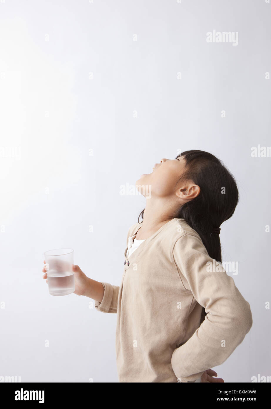 A girl gargleing her throat Stock Photo - Alamy