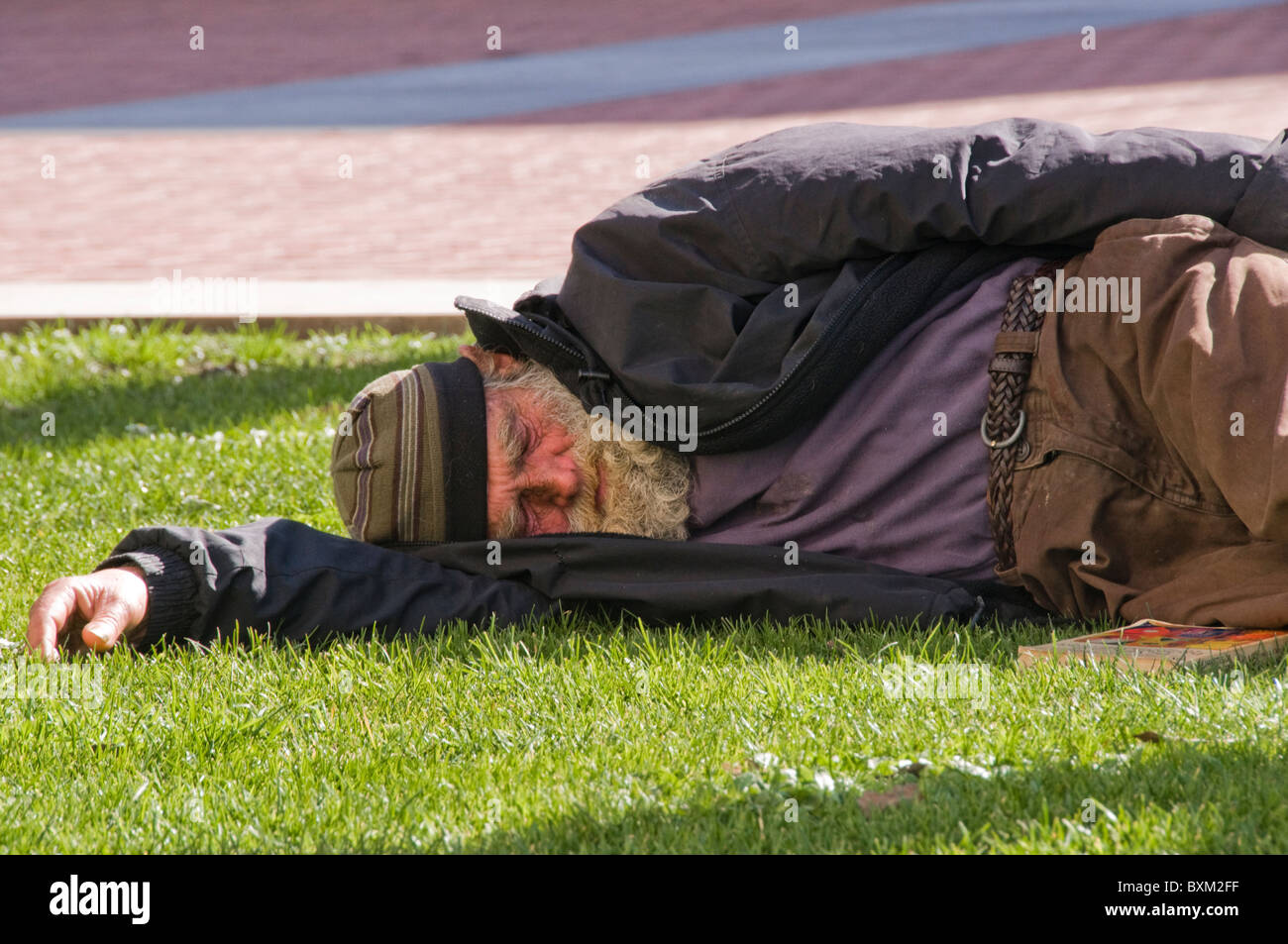 Homeless man sleeping in city park in San Francisco CA USA California ...