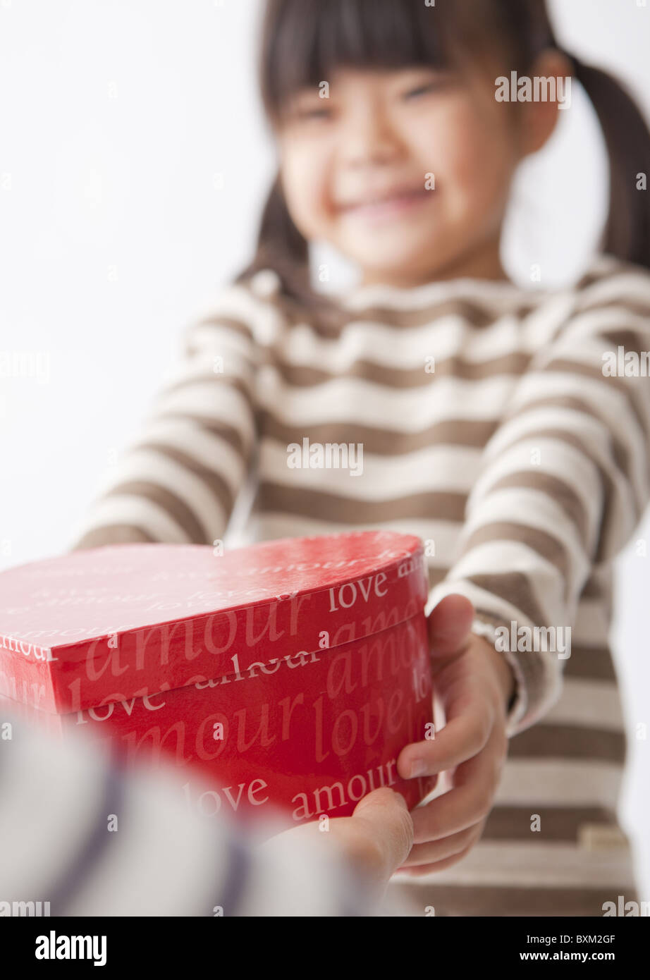 A girl sending a present Stock Photo - Alamy