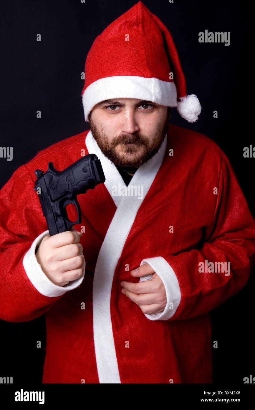 Santa with gun hi-res stock photography and images - Alamy