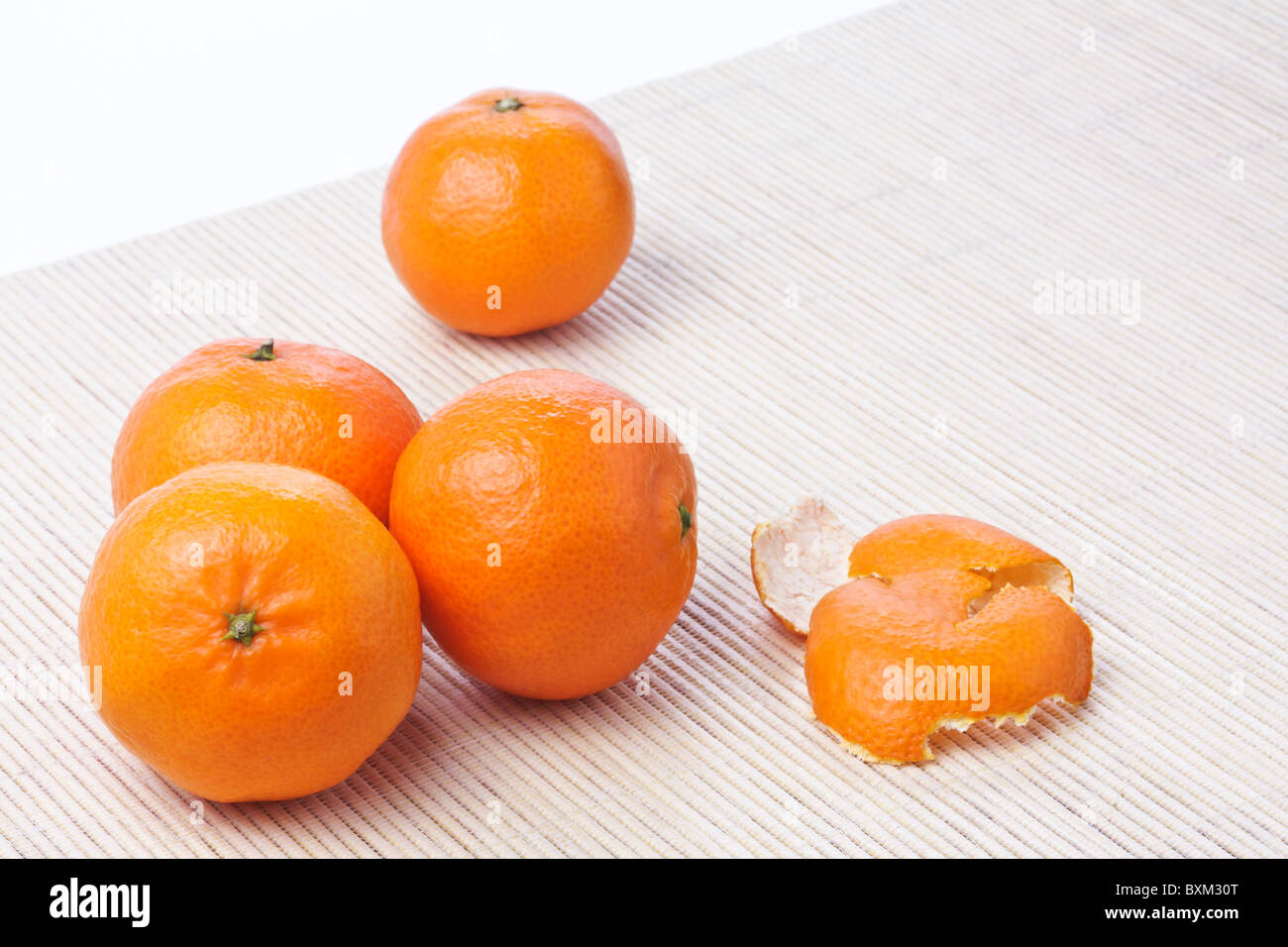 Pile of ripe fresh orange tangerines and piece of peel Stock Photo - Alamy