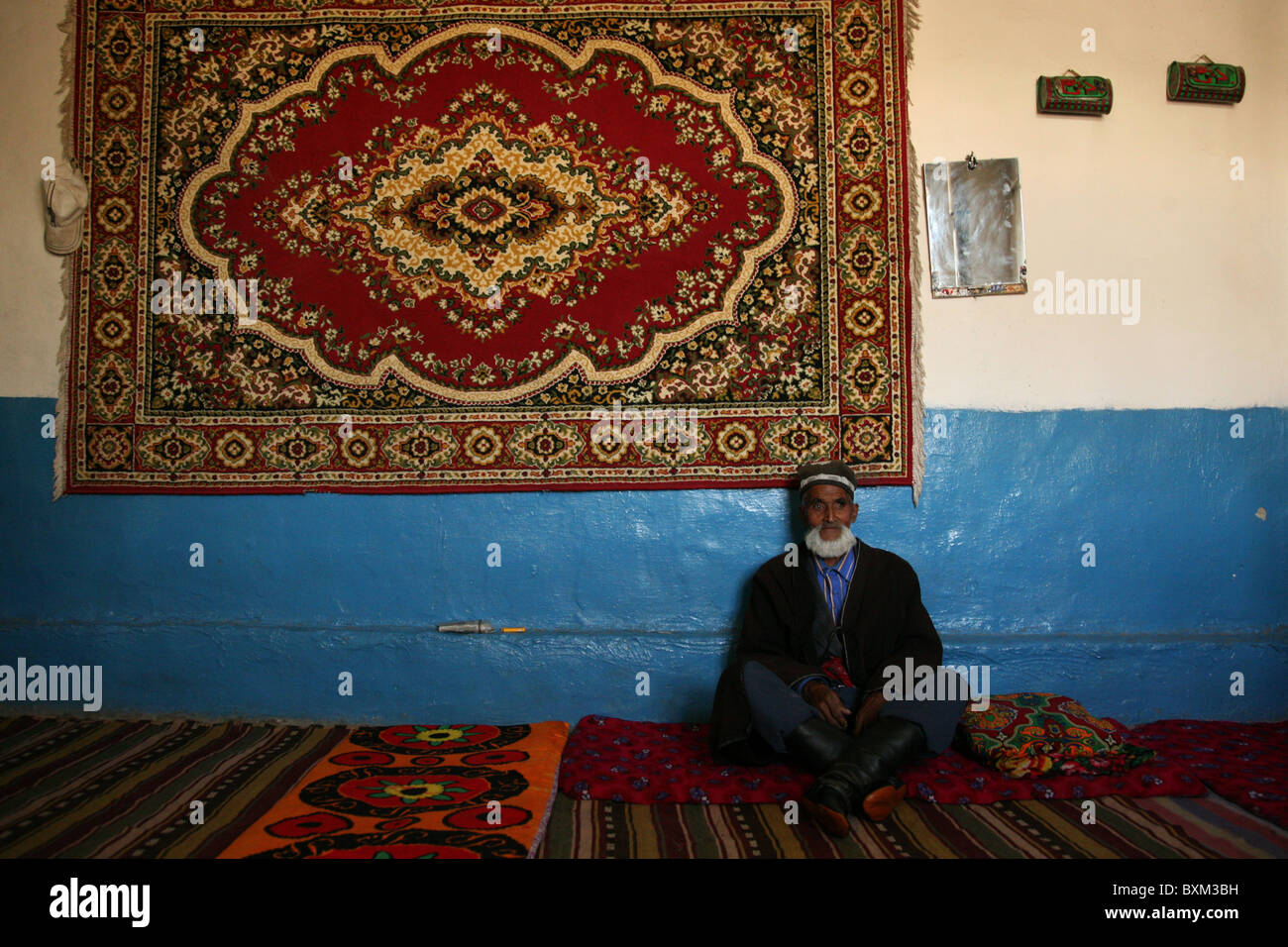 Old man sitting in his house in the gypsy village of Gigikhana near Bukhara, Uzbekistan Stock ...