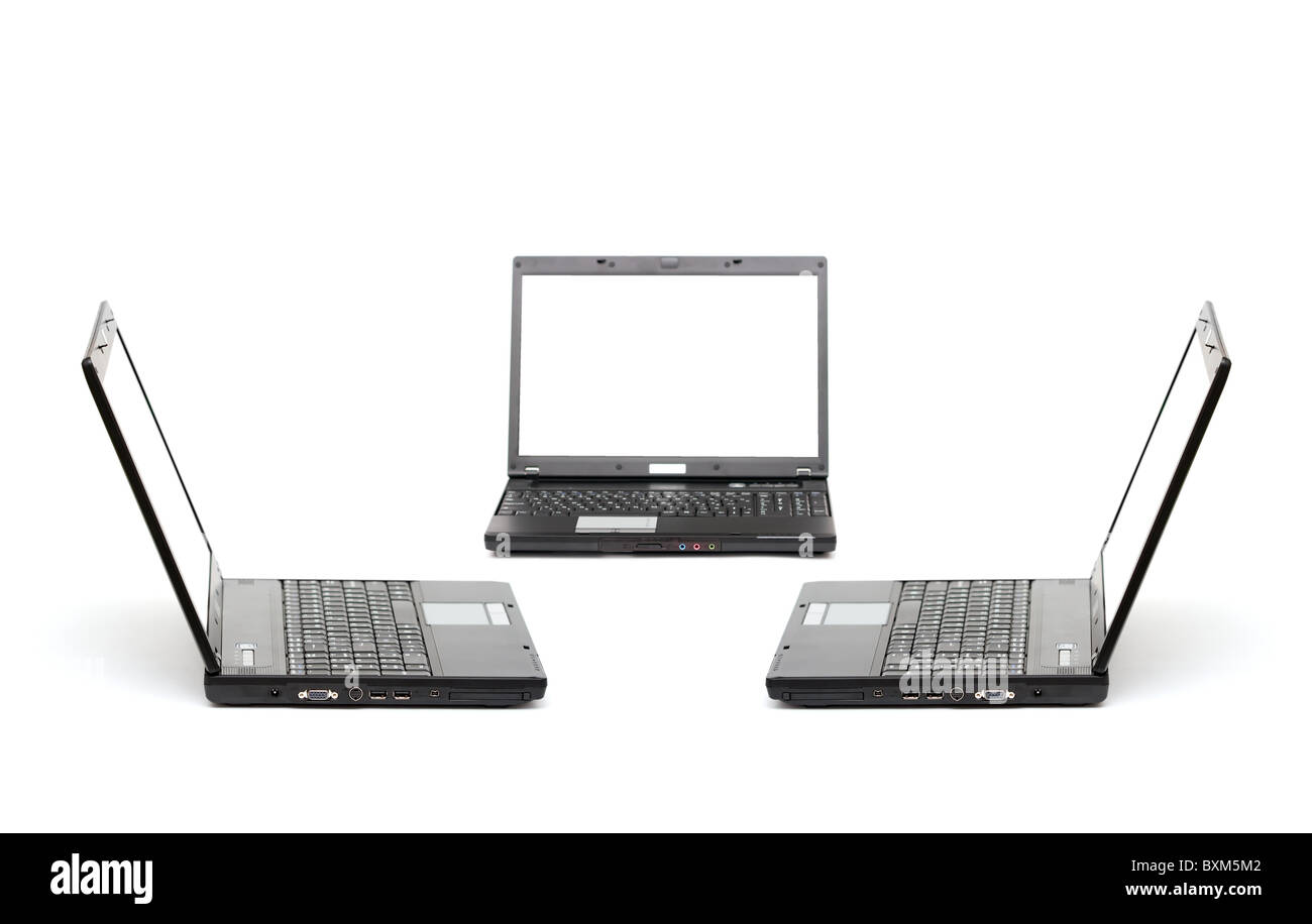 Three laptops facing each other with blank screens Stock Photo - Alamy