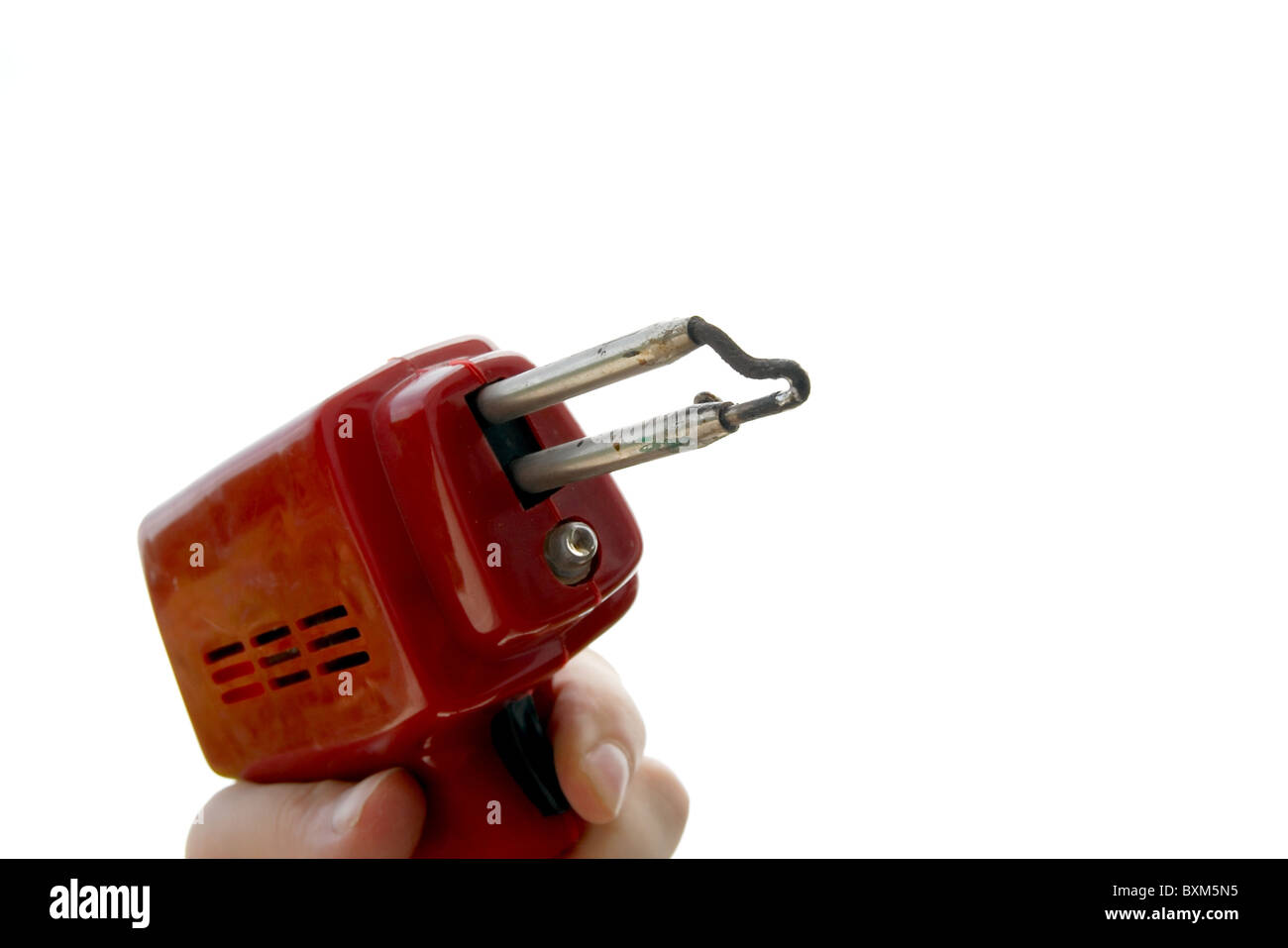 Soldering iron in human hand isolated on white Stock Photo - Alamy