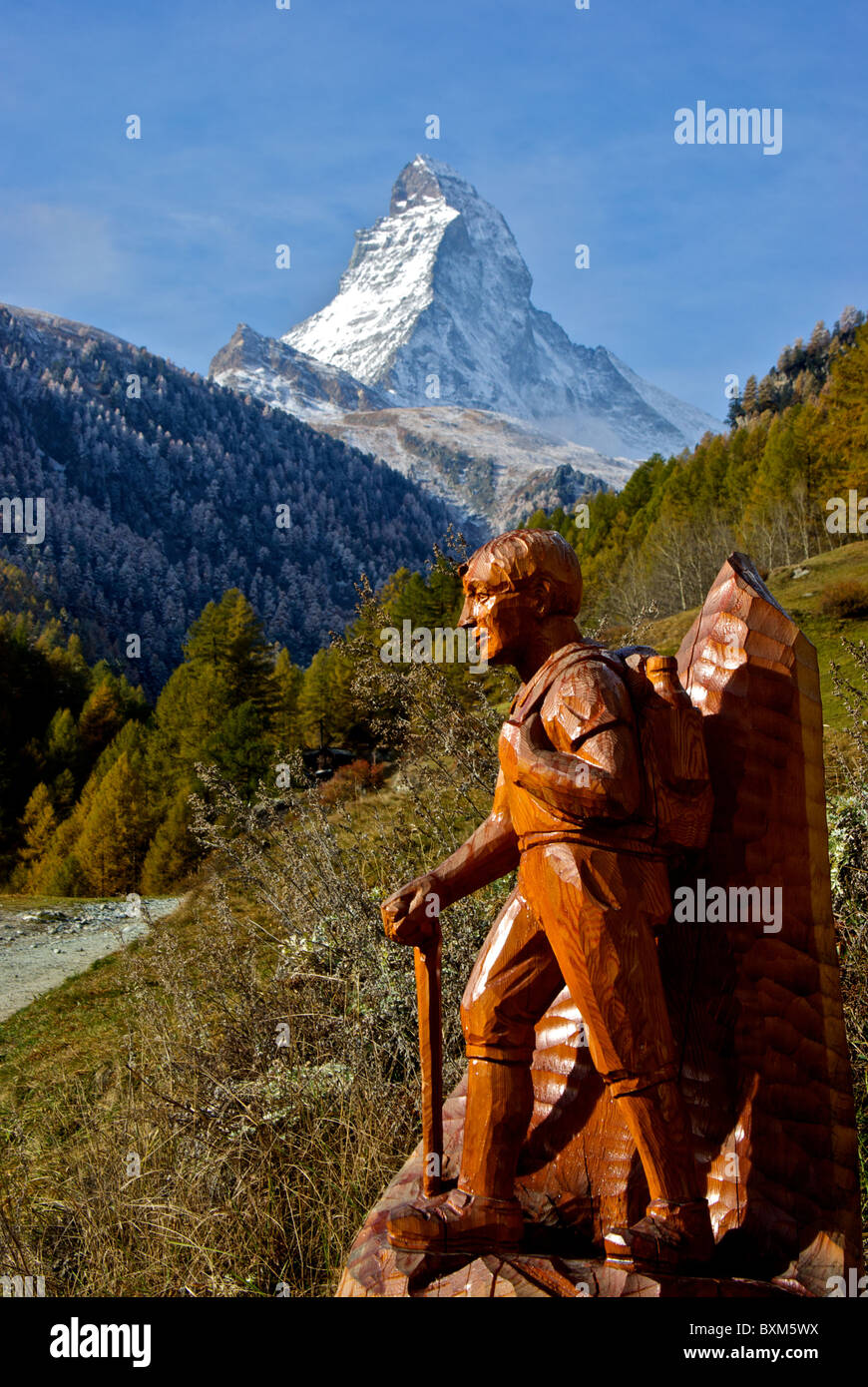 Wooden sculpture of hiker at trailhead of one of many trails leading to ...
