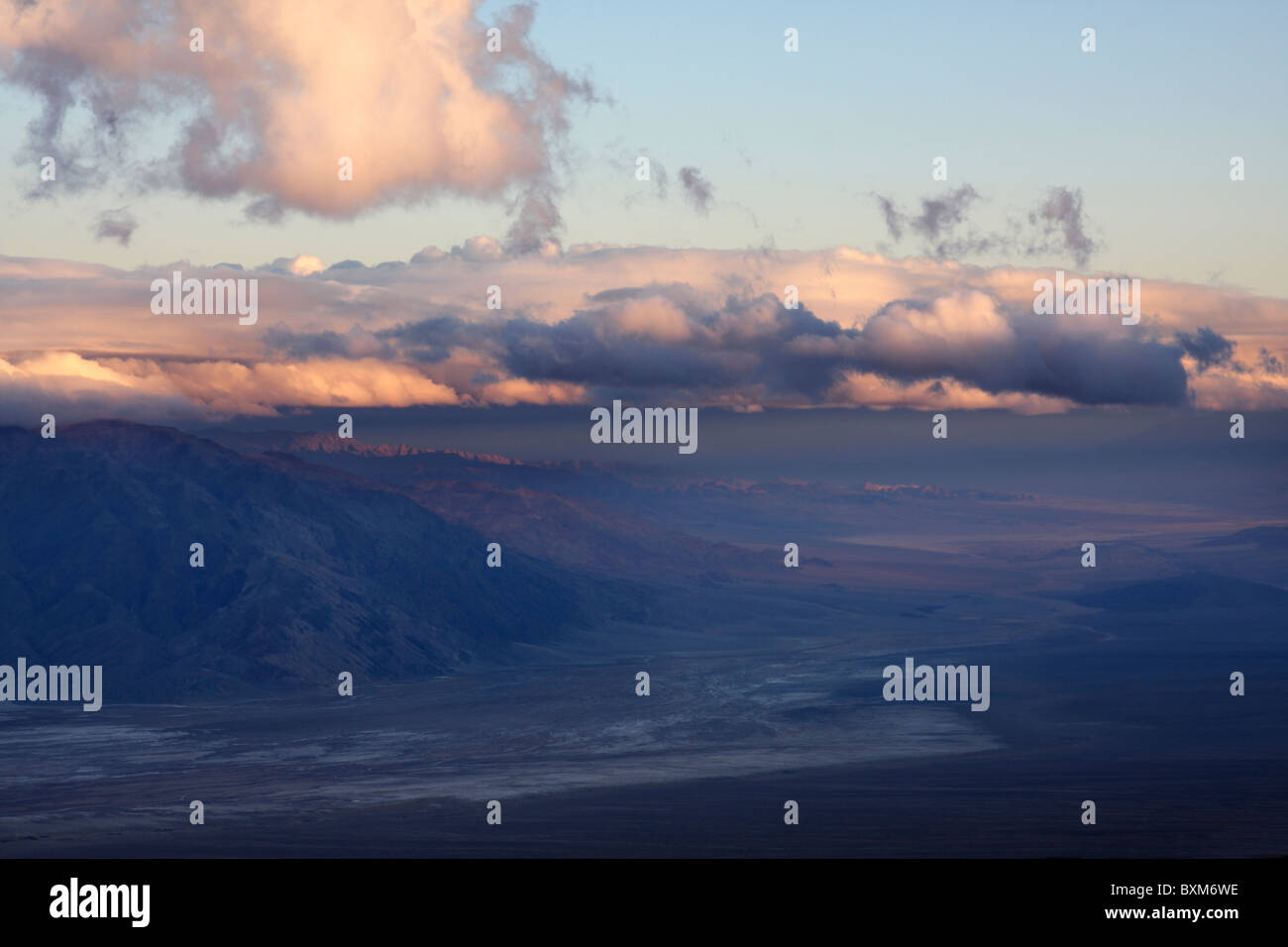 The last of the day's light touches the peaks of the Amargosa Range in ...