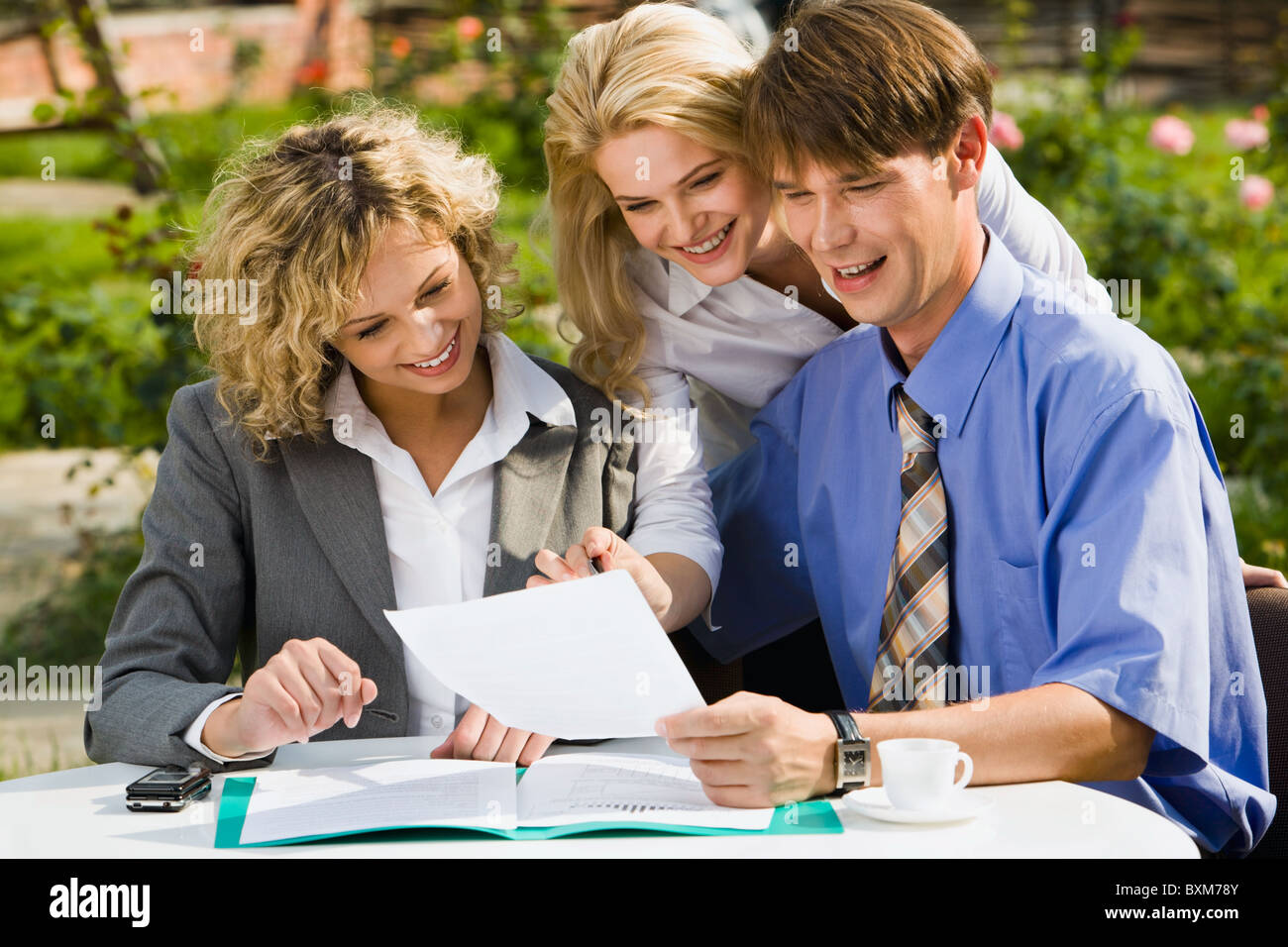 Confident business woman is explaining the correct way of report to her ...