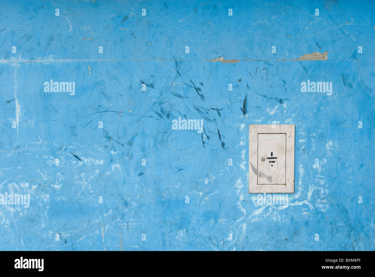 electricity control panel box on a dirty blue wall Stock Photo - Alamy