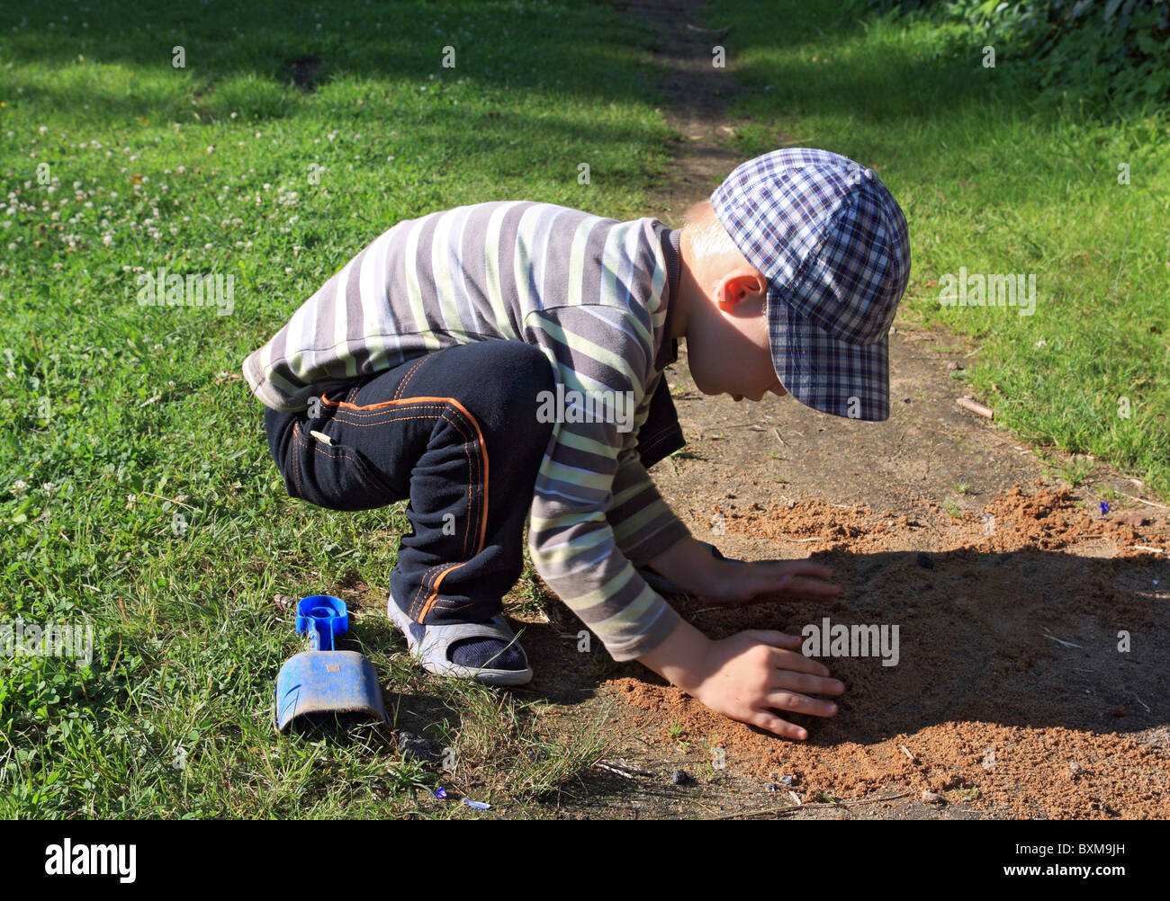 boy in sand Stock Photo - Alamy