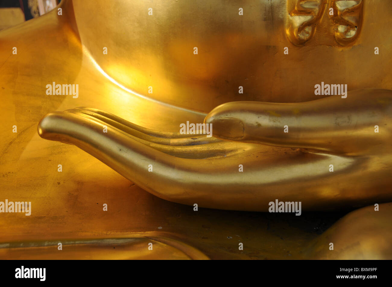 Hand of a golden Buddha Stock Photo - Alamy
