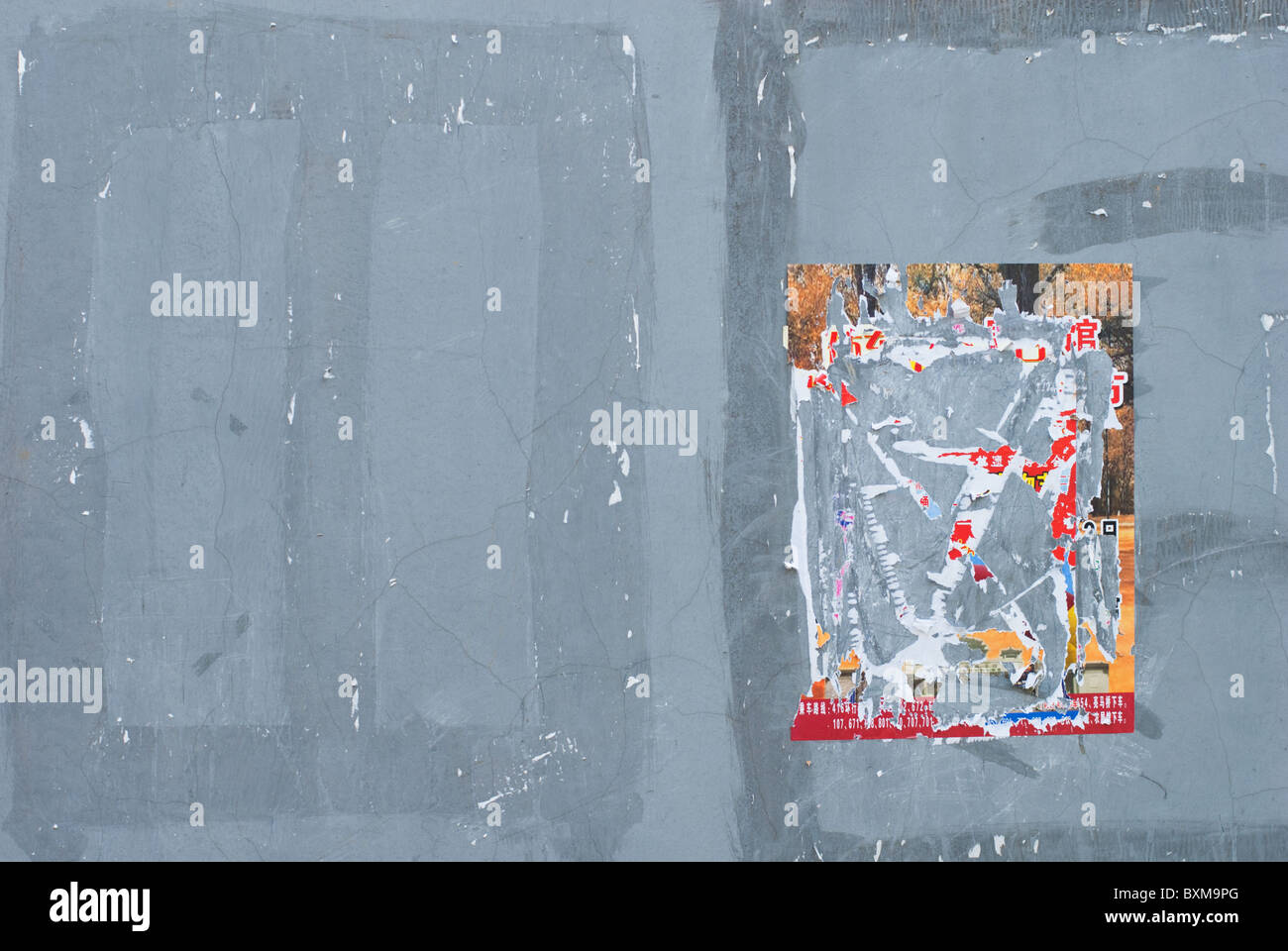 teared up layers of posters on a concrete wall Stock Photo - Alamy