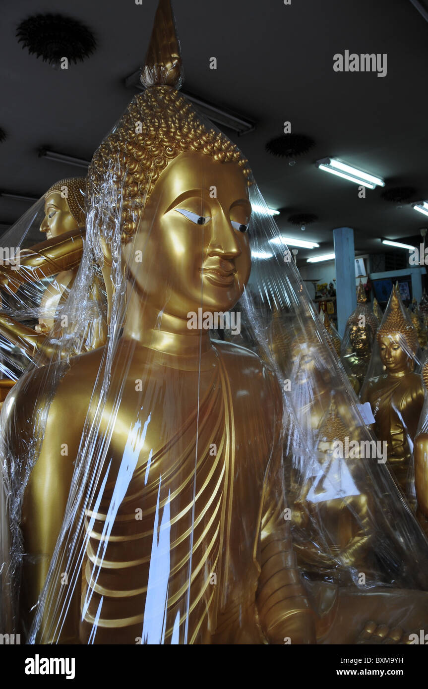 Golden Buddha in Plastic Stock Photo - Alamy