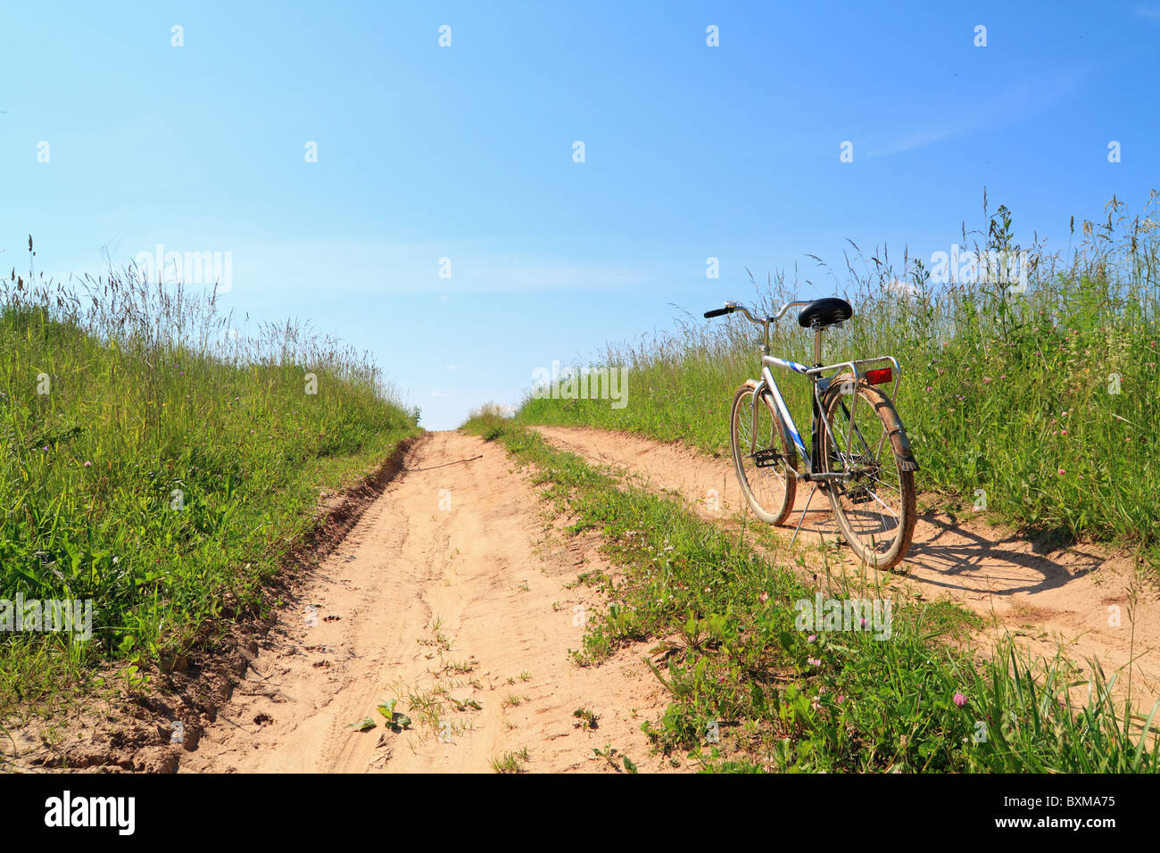 old bicycle on rural road Stock Photo - Alamy