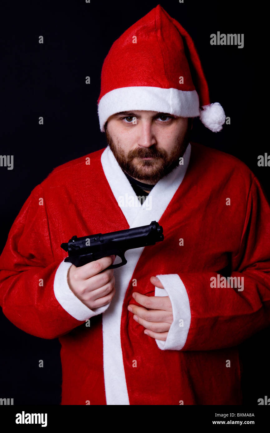 Santa with gun hi-res stock photography and images - Alamy