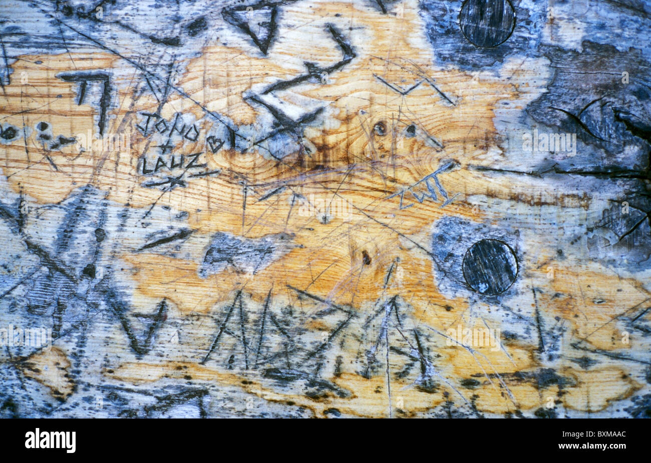 Graffiti cut into a wood bench Clent Hills Worcestershire UK Stock ...